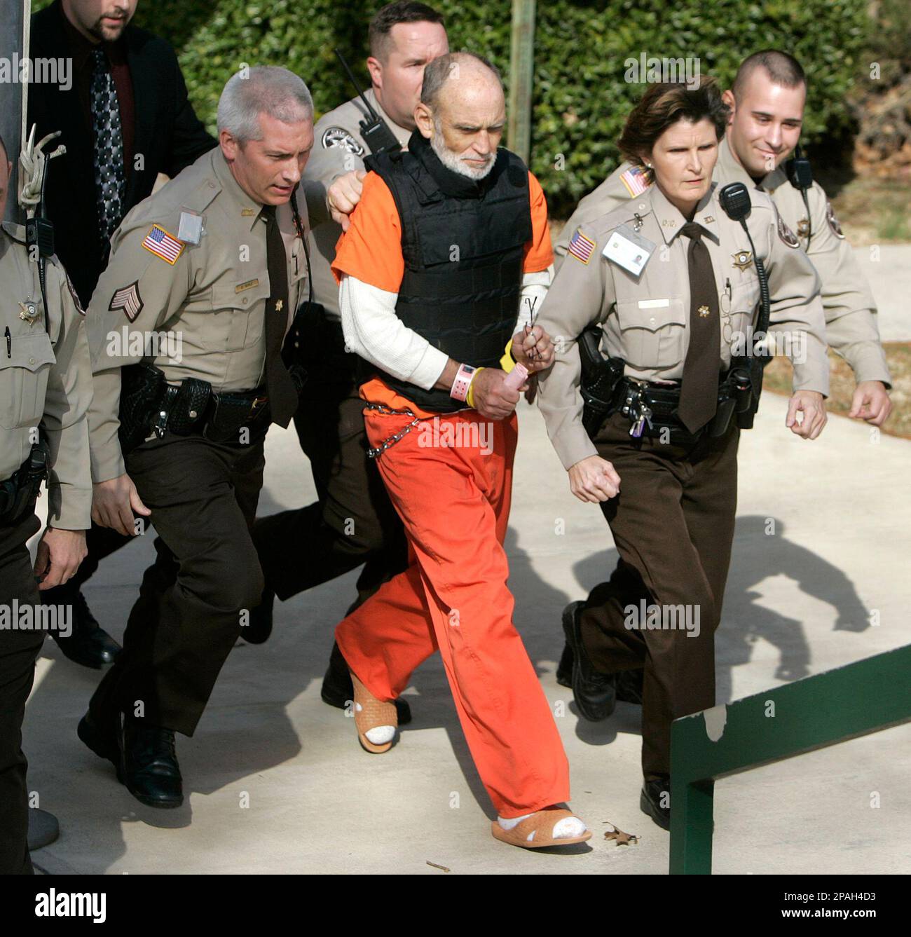 Gary Michael Hilton is escorted from the Dawson County Courthouse after ...