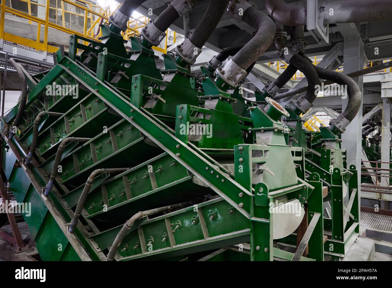 Machine tool operates with mineral ore at mining plant Stock Photo - Alamy