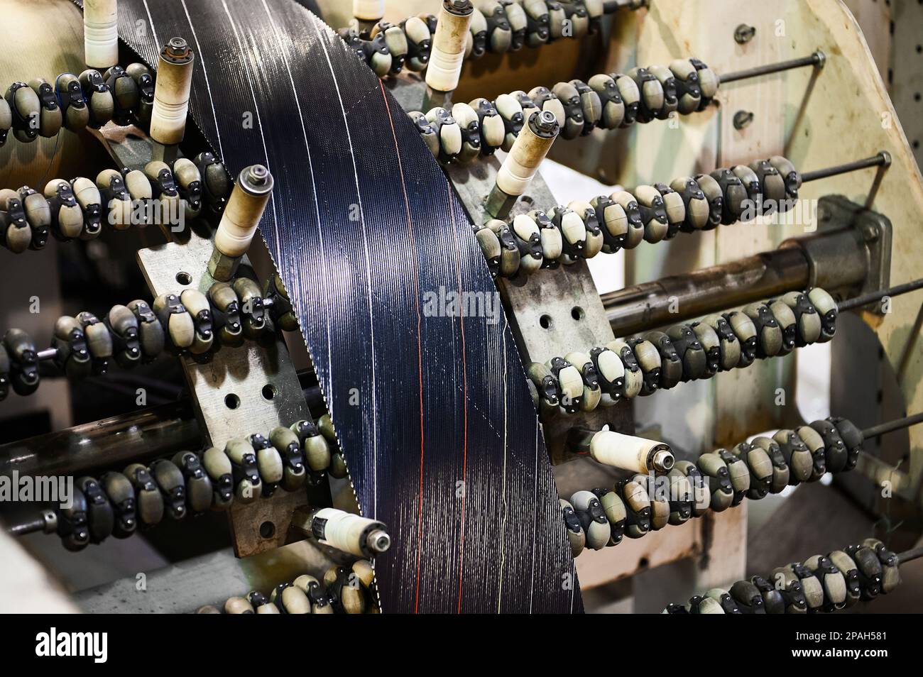 Reinforced fabric rubber tape with threads in workshop Stock Photo - Alamy