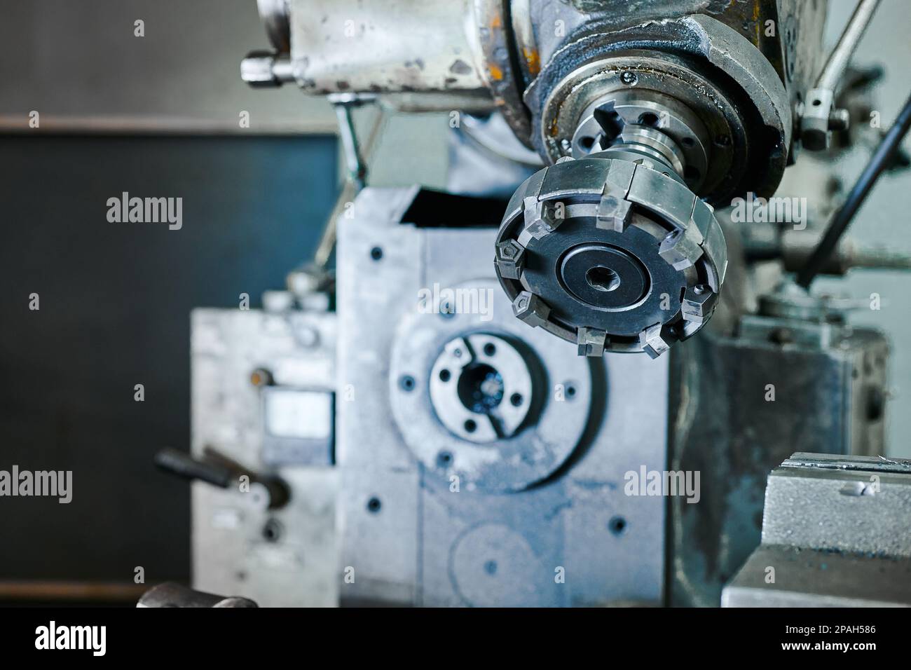 Shell type end mill installed on old machine tool in shop Stock Photo ...
