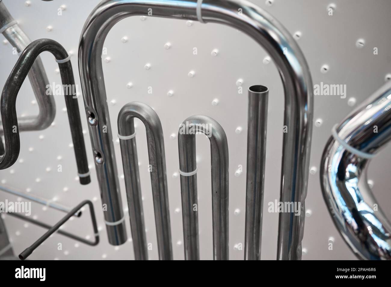 Shiny steel pipes on display in contemporary hardware store Stock Photo ...