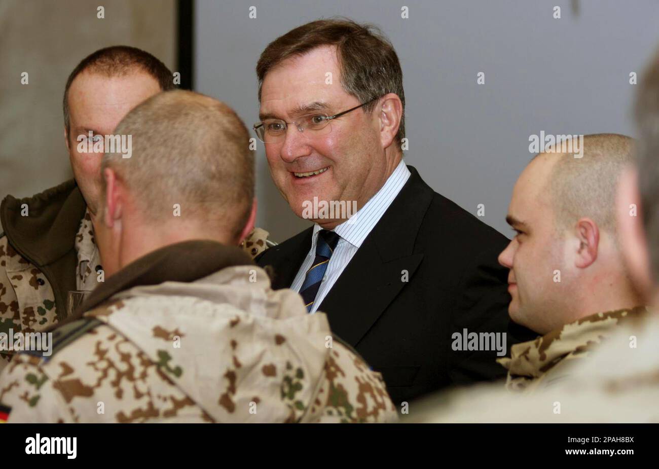 Germany's Defense Minister Franz-Josef Jung center talks to German ISAF ...