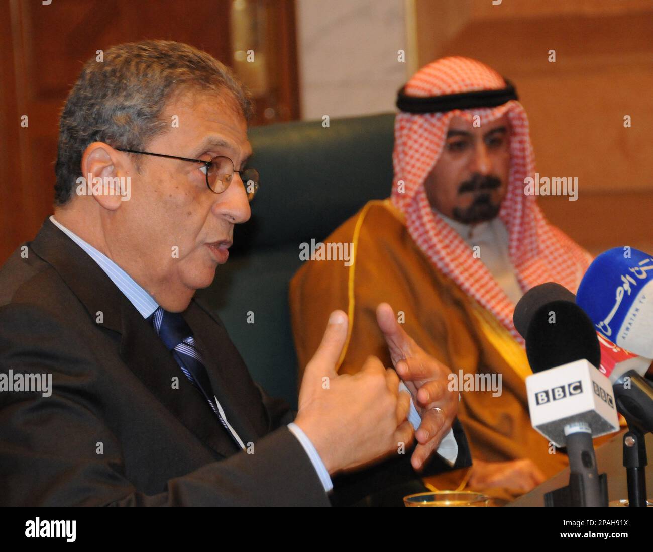 Arab League Secretary General Amr Moussa, left, talks to journalists ...