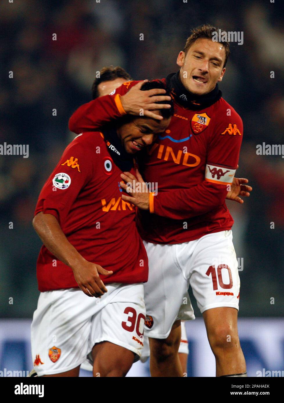 AS Roma's Mancini of Brazil, left, celebrates after scoring with ...