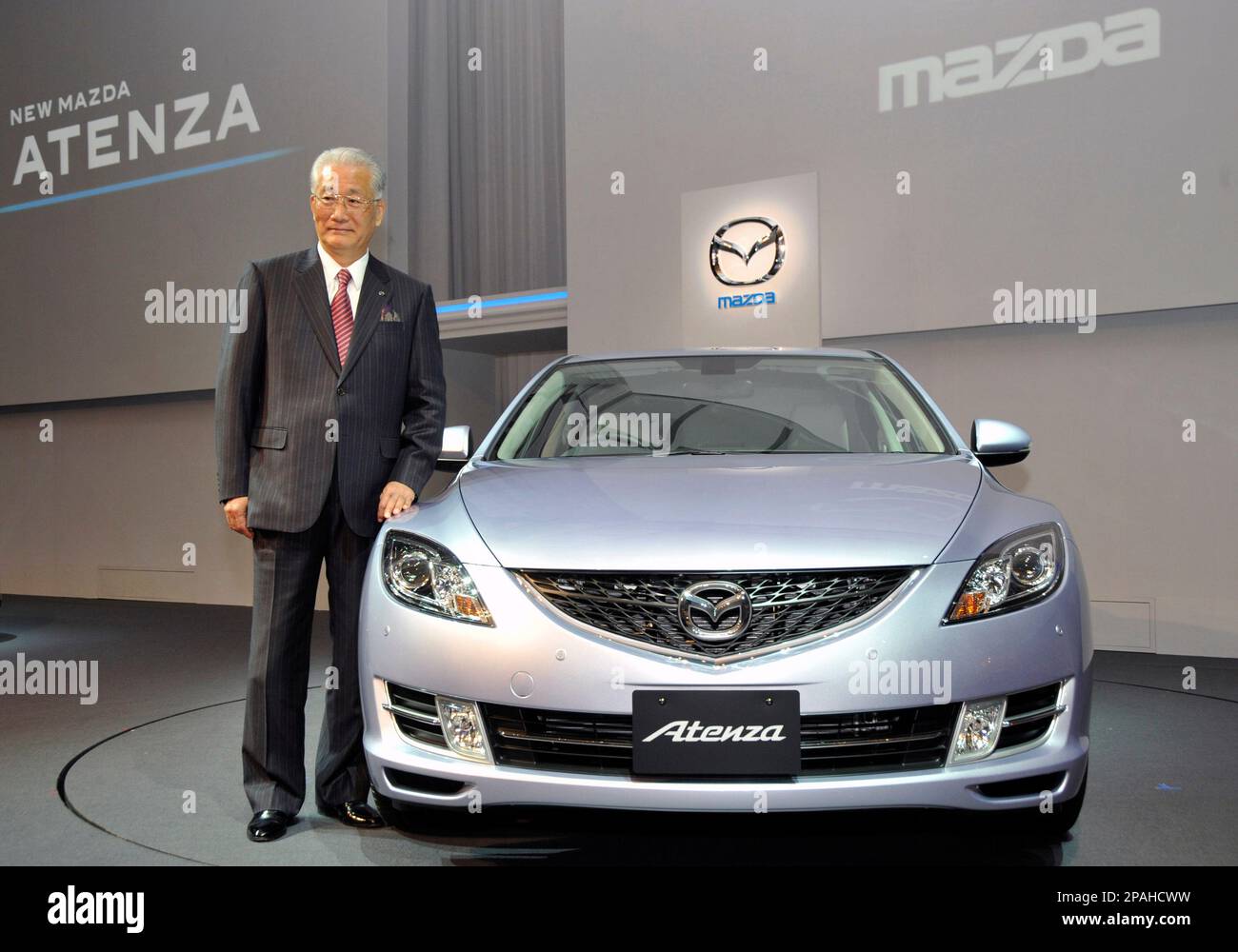Mazda Motor Corp. President Hisakazu Imaki poses with a fully remodeled ...