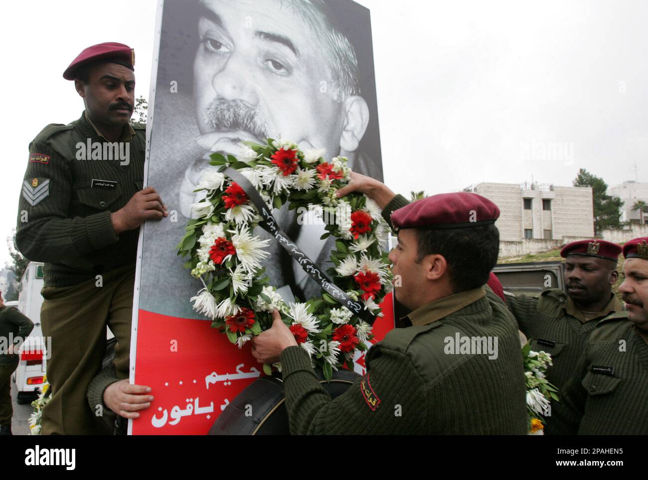 Members of Jordanian based Palestinian Liberation Army place flowers on ...