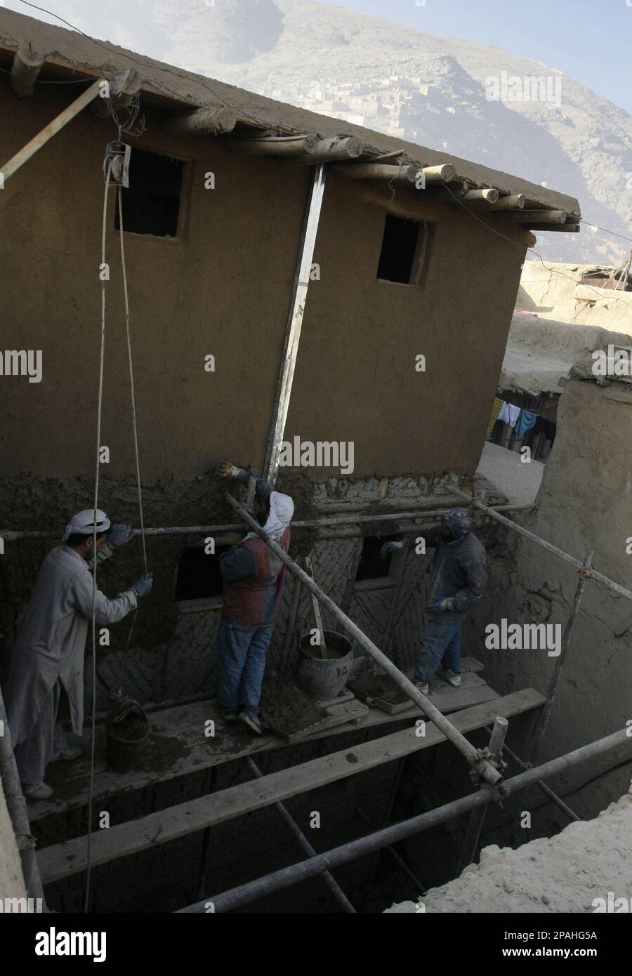 Laborers for the Aga Khan Trust for Culture project work in the old ...