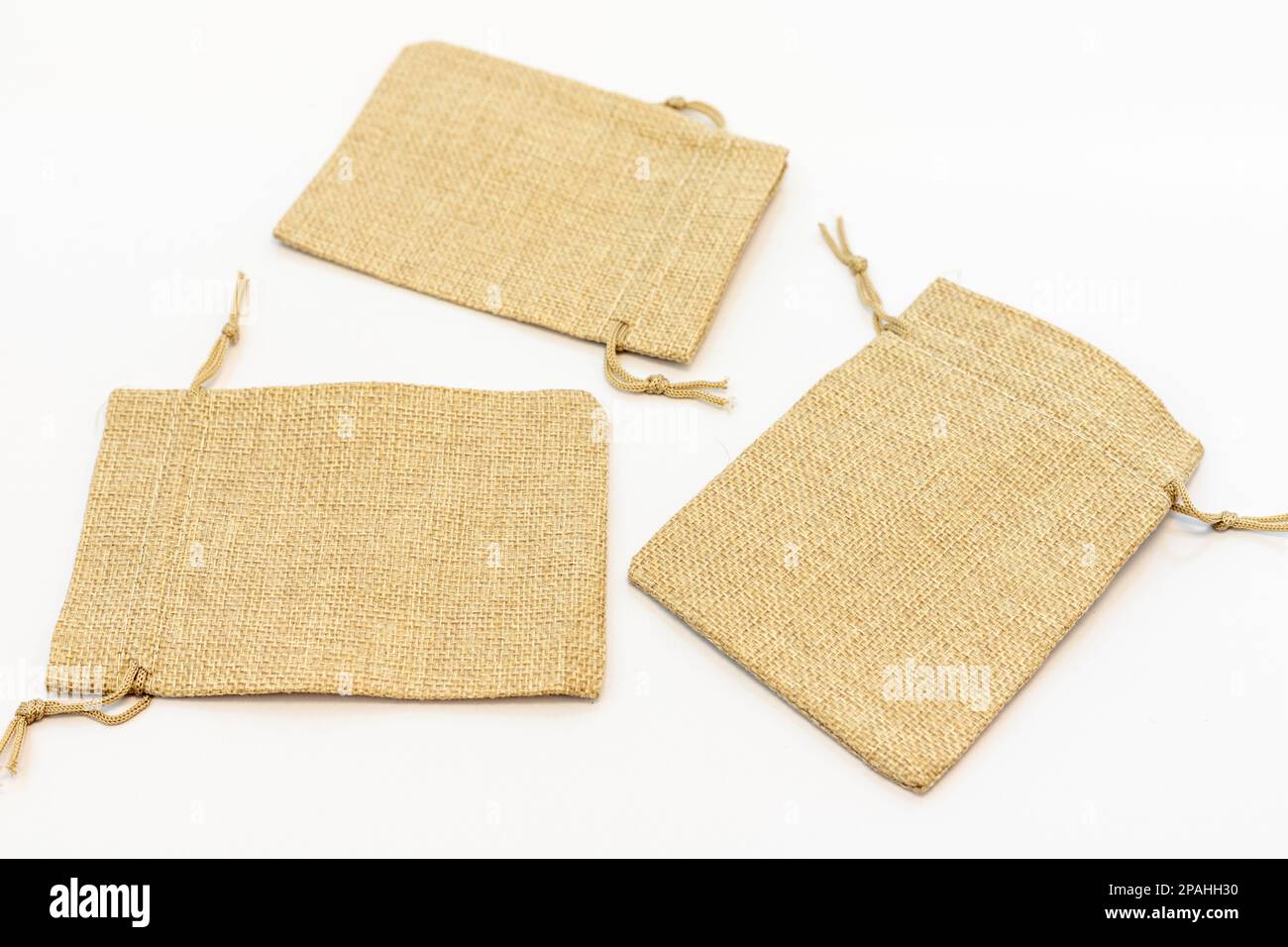 Empty sack bags for gift on white background Stock Photo - Alamy