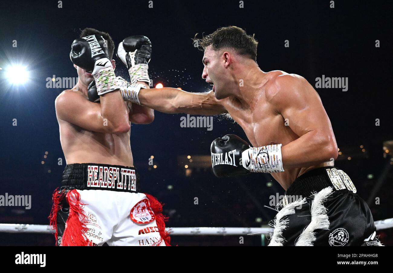 Rohan Murdock (R) strikes Issac Hardman during their IBF Australasian ...