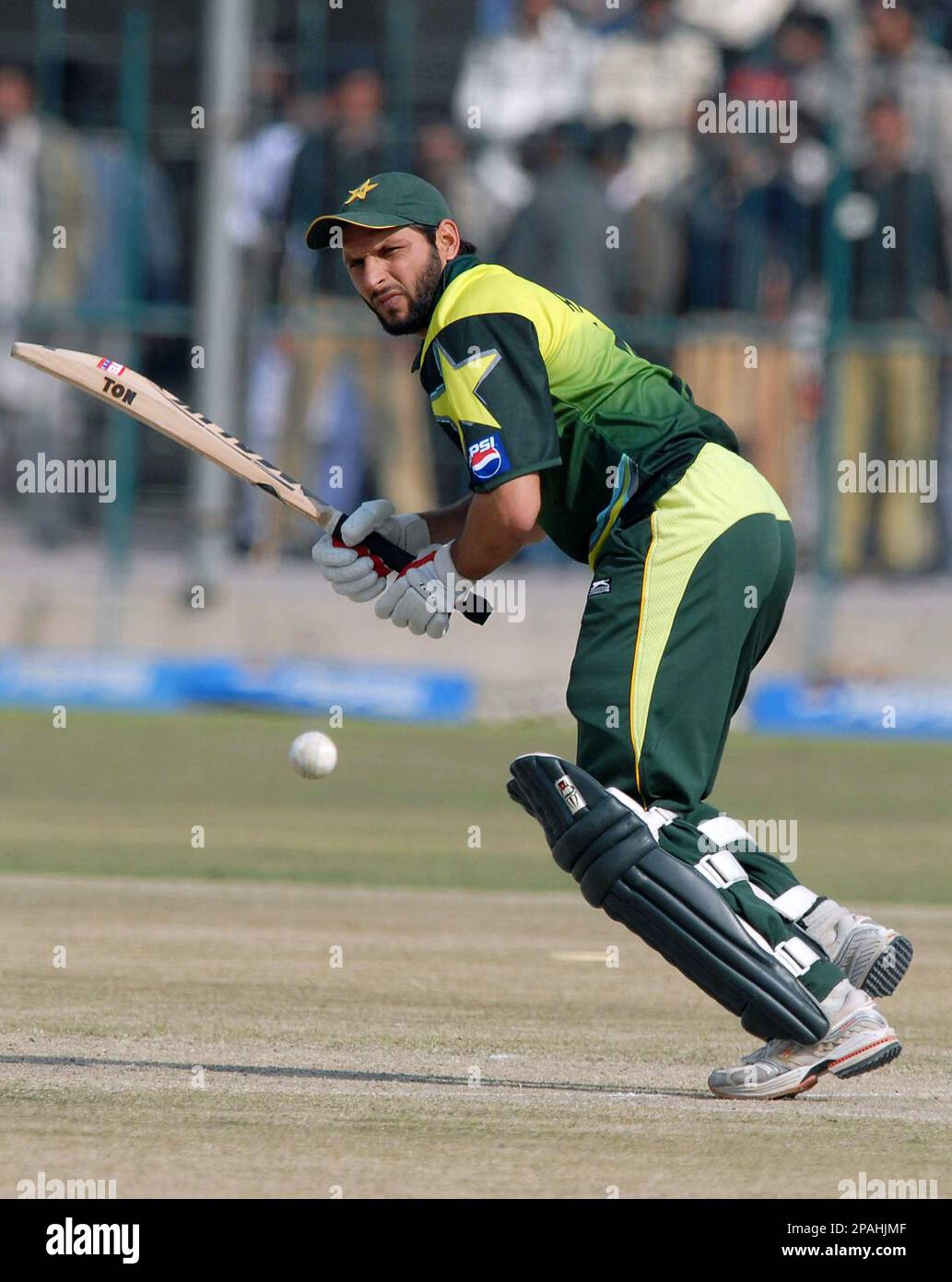 Pakistan's all-rounder Shahid Afridi, who scored 85 runs, follows the ...