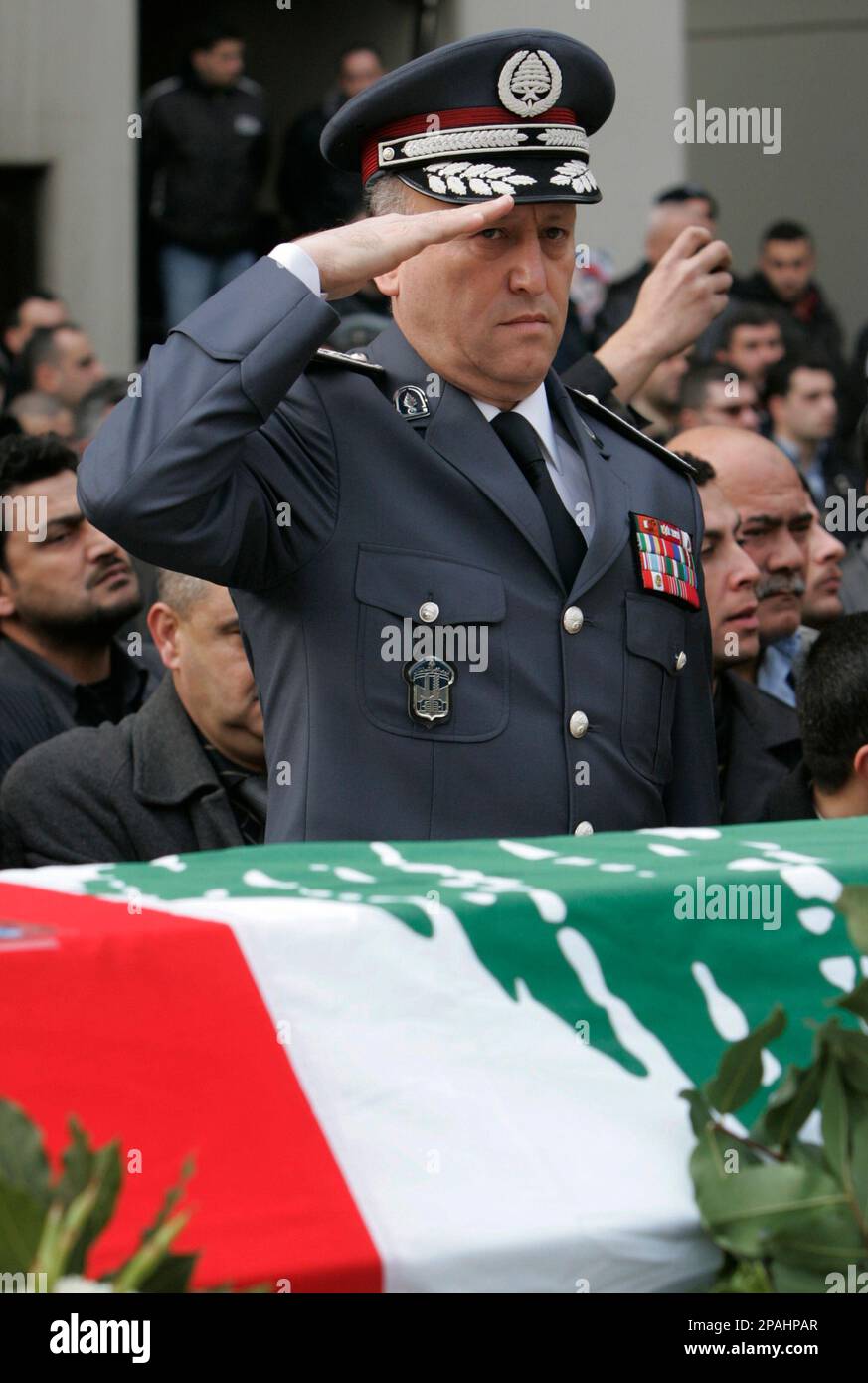 Lebanese police chief, Brig. Gen. Ashraf Rifi, salutes as he stand next ...