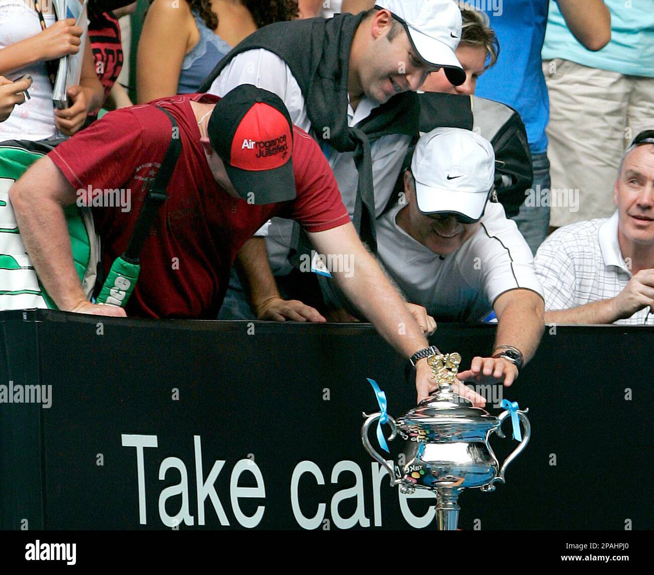 Russia's Maria Sharapova's father Yuri, second right, reaches out to ...