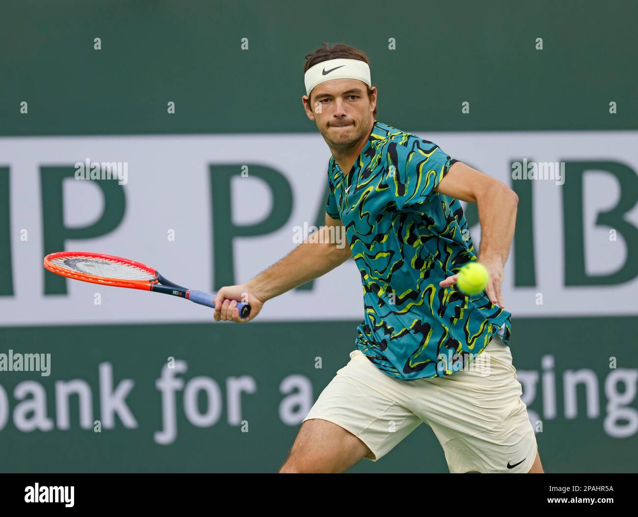 March 11, 2023 Taylor Fritz returns a shot against Ben Shelton during ...