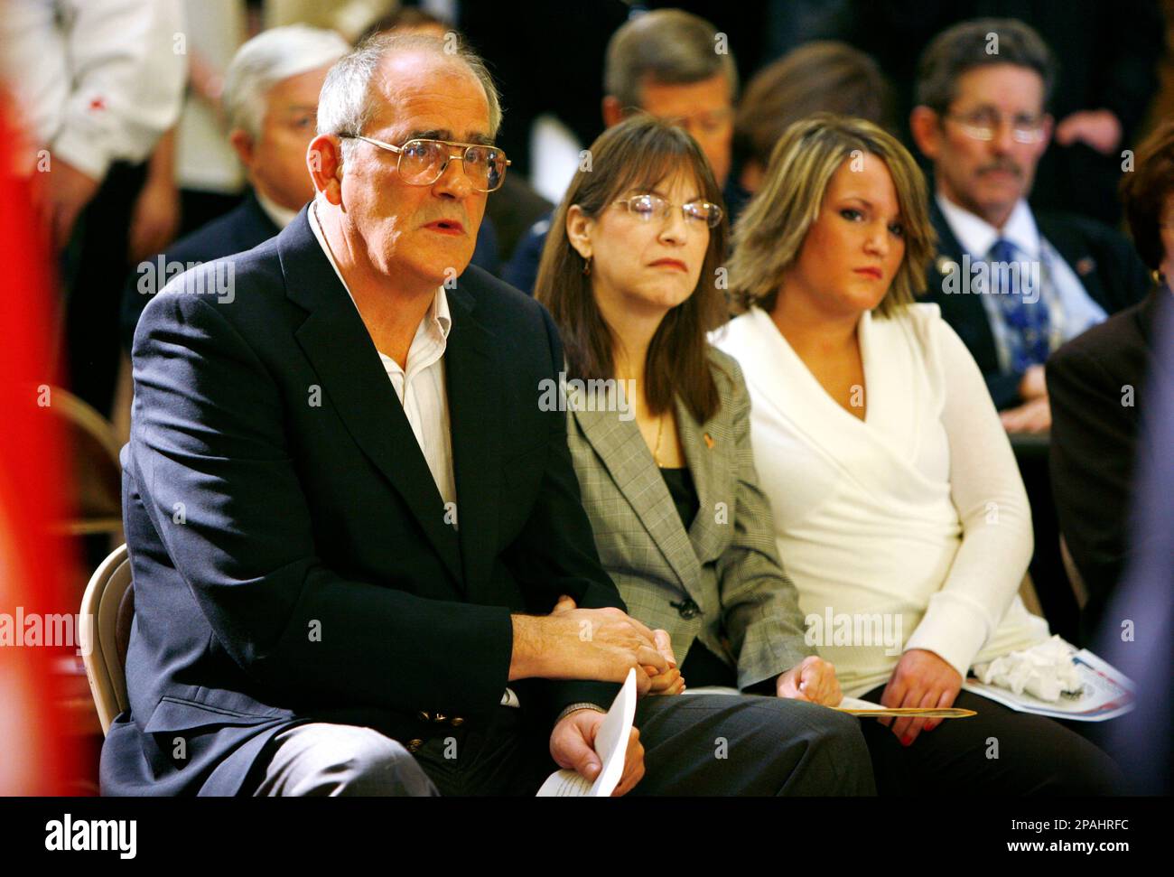 Randy Omvig, of Grundy Center, Iowa, sits with his wife Ellen, center ...