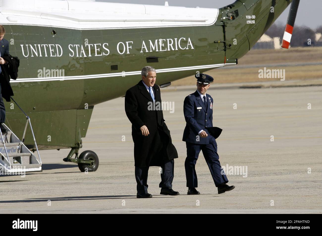 President Bush walks with Col. Eric Snadecki, Vice Commander, 316th ...