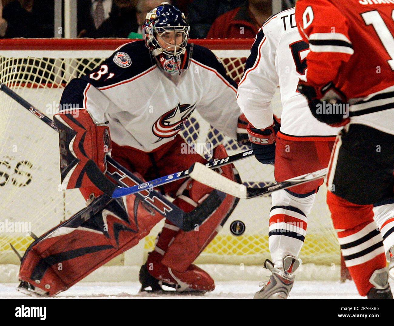 Columbus Blue Jackets goalie Pascal LeClaire tries to catch the puck ...