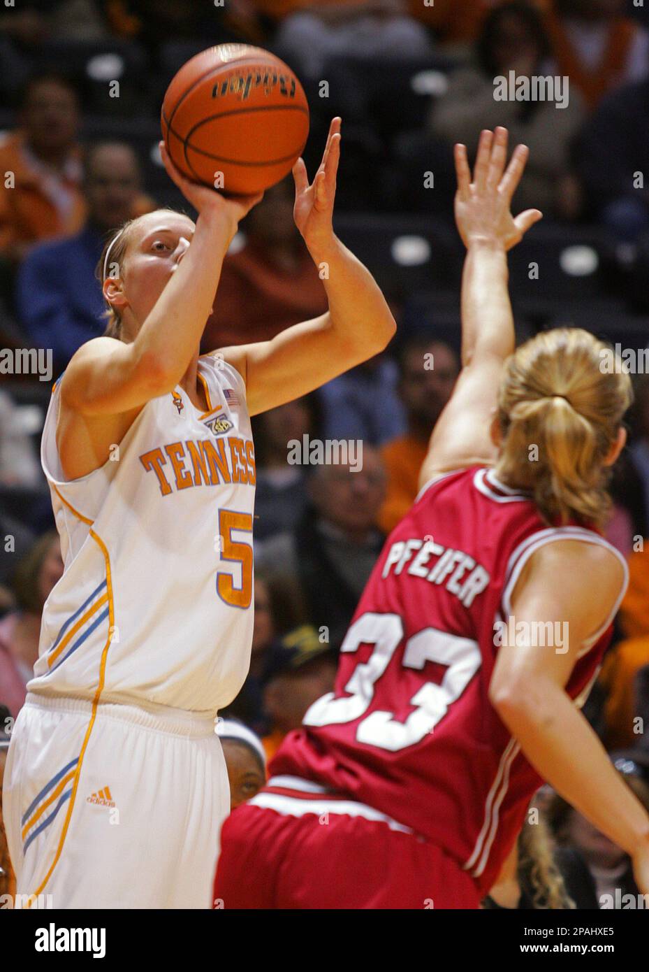 Tennessee's Angie Bjorklund (5) shoots over Arkansas' Sarah Pfeifer ...
