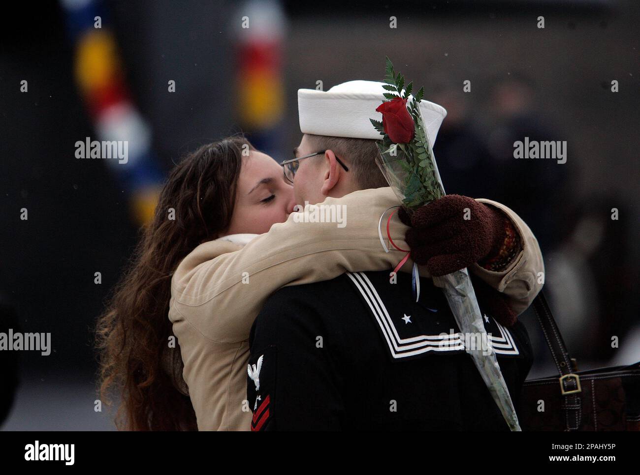 Petty Officer Michael McCraw and his wife, Marianne, kiss after the ...