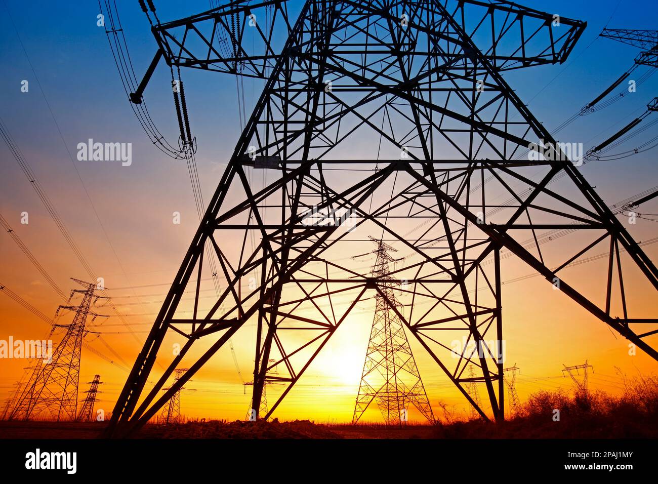 Wire electrical energy at sunset Stock Photo - Alamy