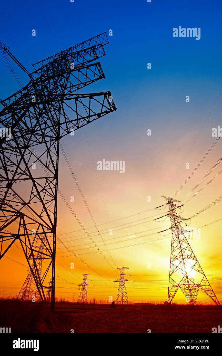 Wire electrical energy at sunset Stock Photo - Alamy