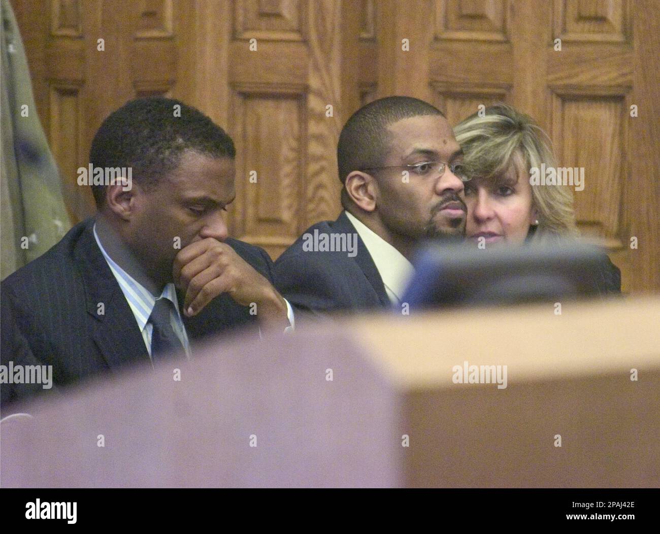Bobby L. Cutts Jr. sits at the defense table between attorneys Fernando ...