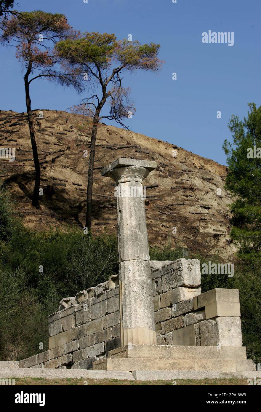 **FILE** A column of the temple of Hera is seen with the burnt Hill of ...