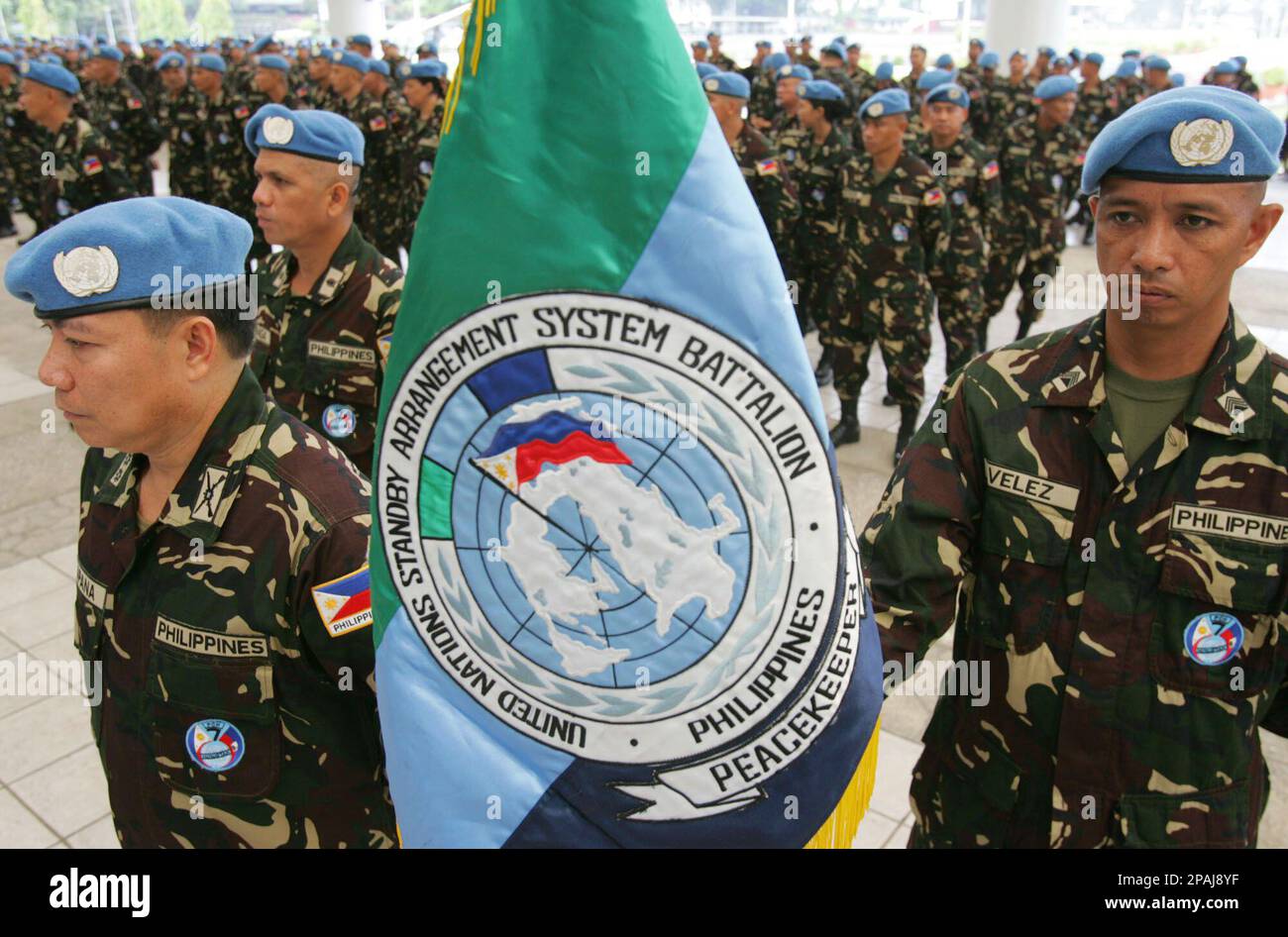Philippine government soldiers stand at attention as they display their ...