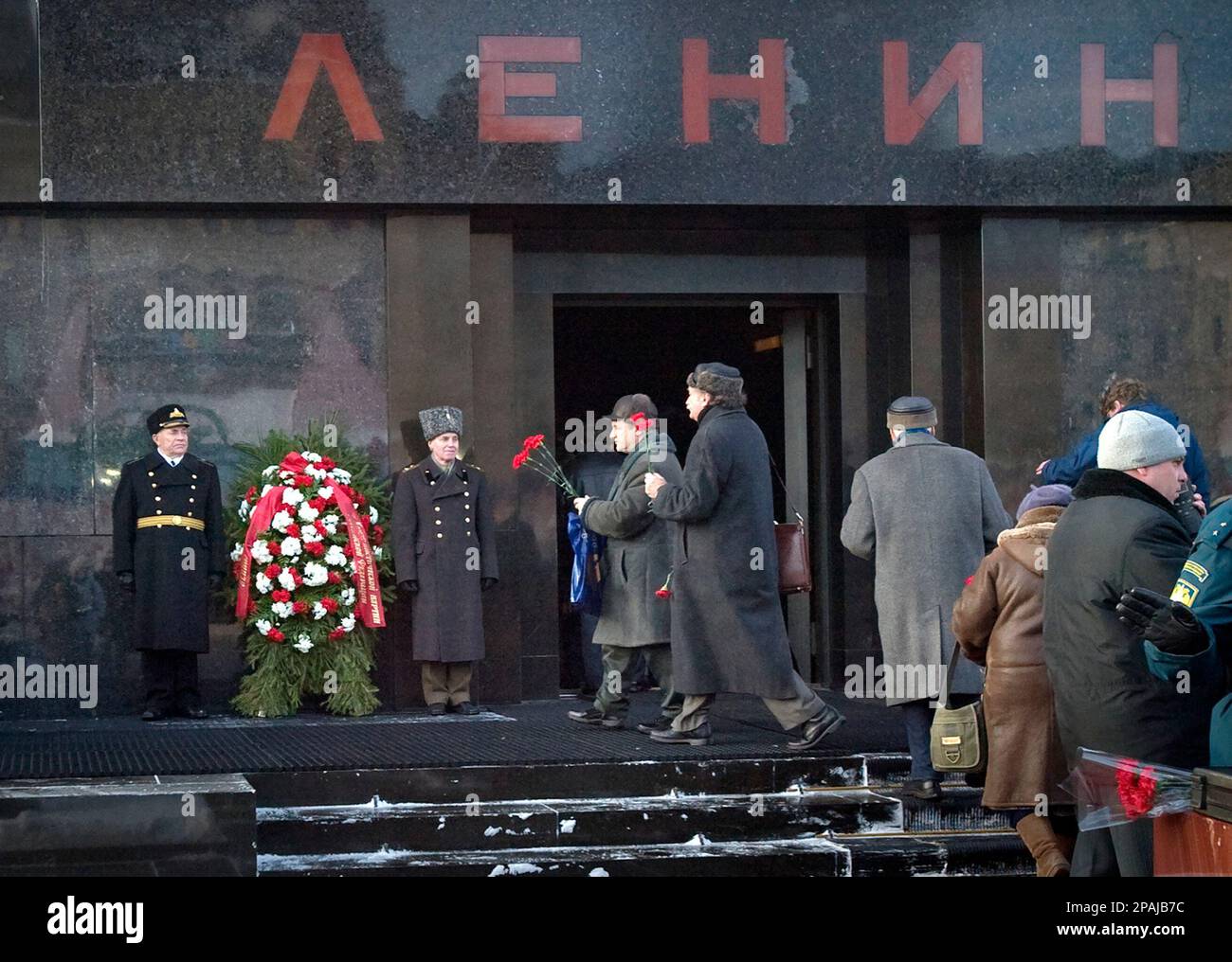 Russian Communists and supporters lay wreaths and flowers at the ...
