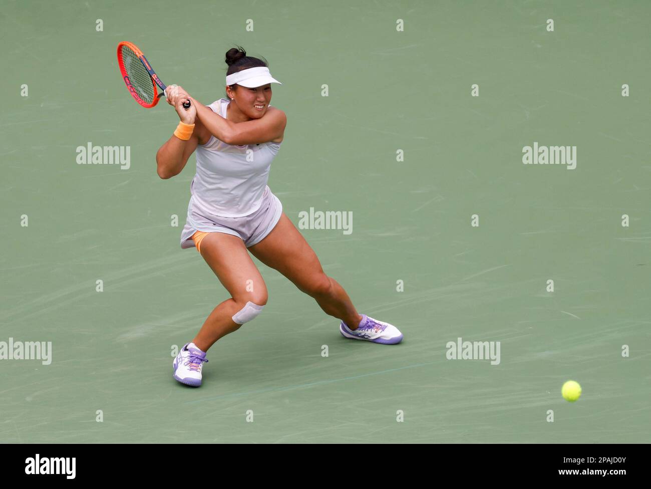 March 11, 2023 Claire Liu returns a shot against Iga Swiatek of Poland ...