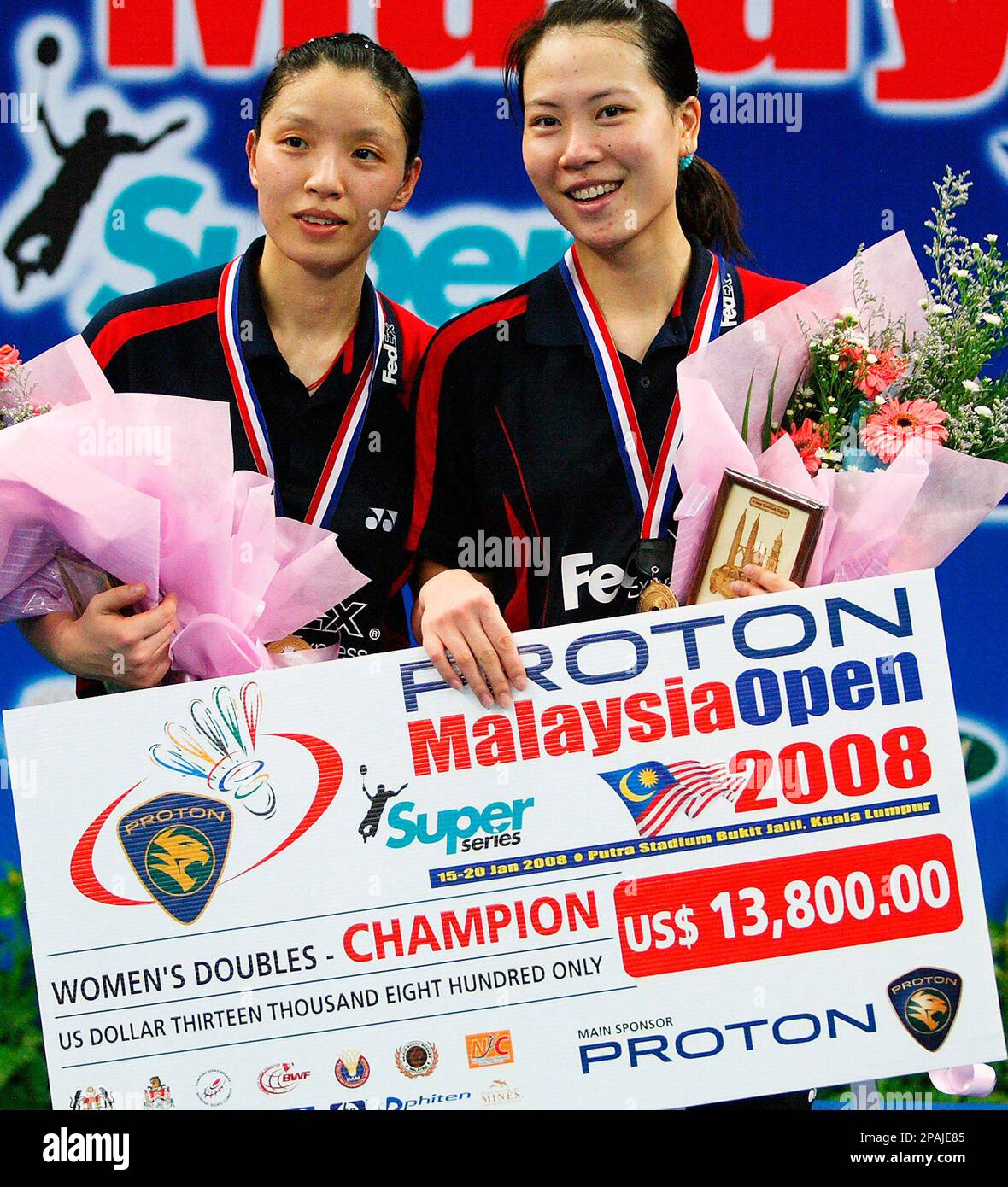 Champion of the women's doubles, Yang Wei, left, and Zhang Jiewen of China pose at the podium ...