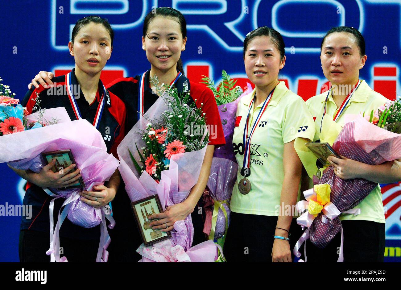 Champion of the women's doubles, Yang Wei, left, and Zhang Jiewen, second left, of China pose ...