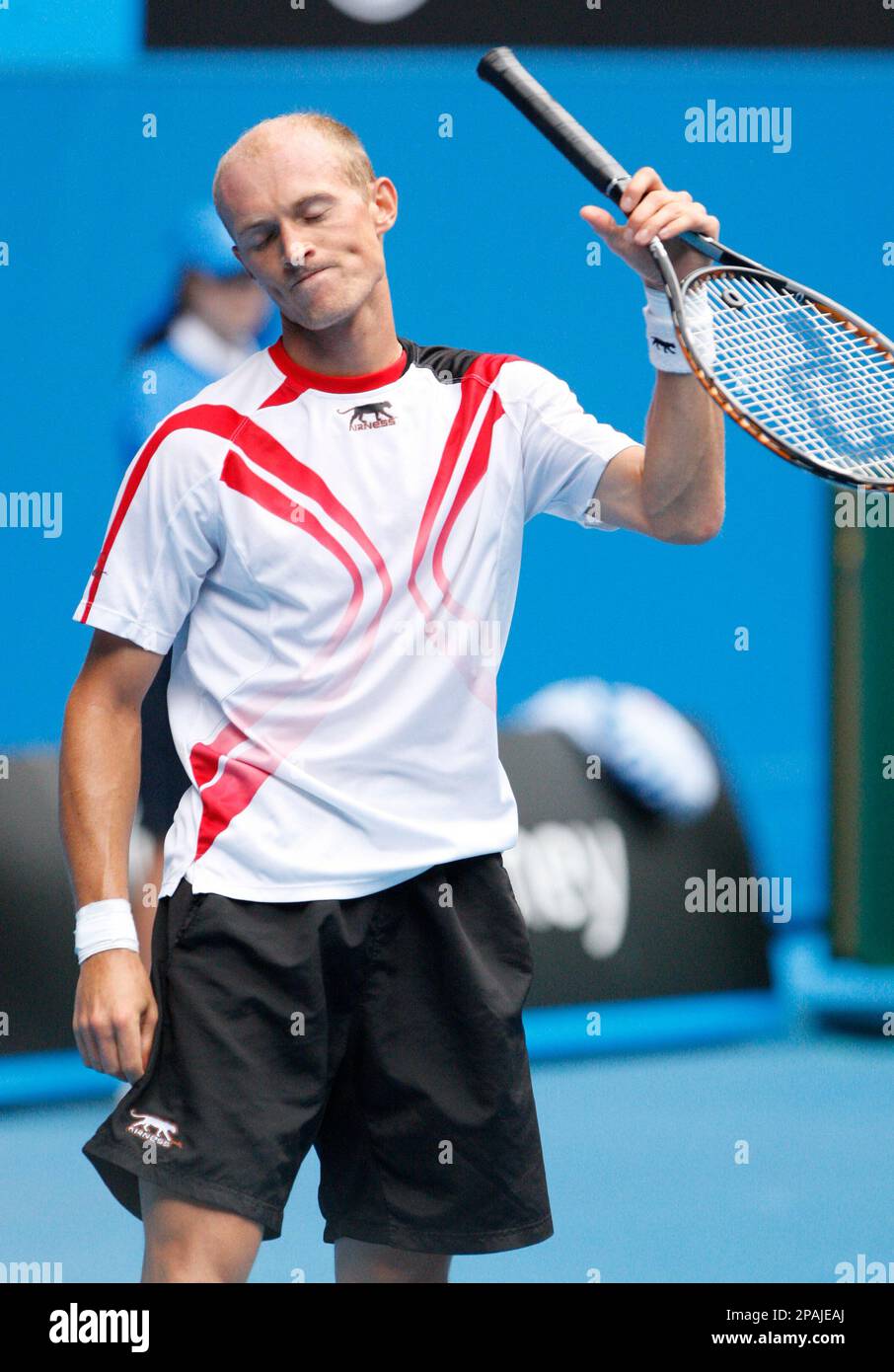 Russia's Nikolay Davydenko reacts as he plays his compatriot Mikhail ...