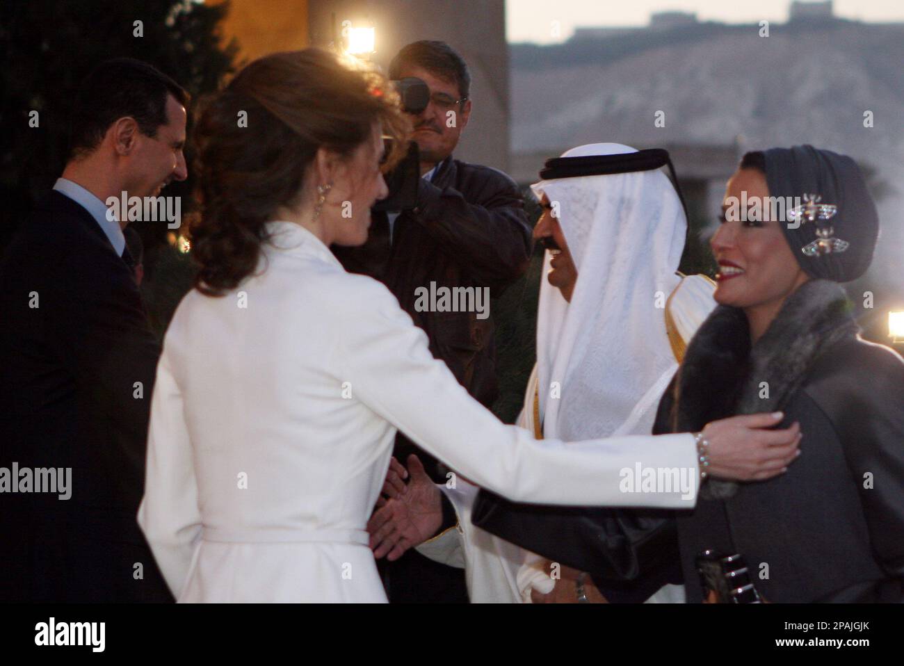 Syrian President Bashar Assad and his wife Assma Assad welcoming the ...