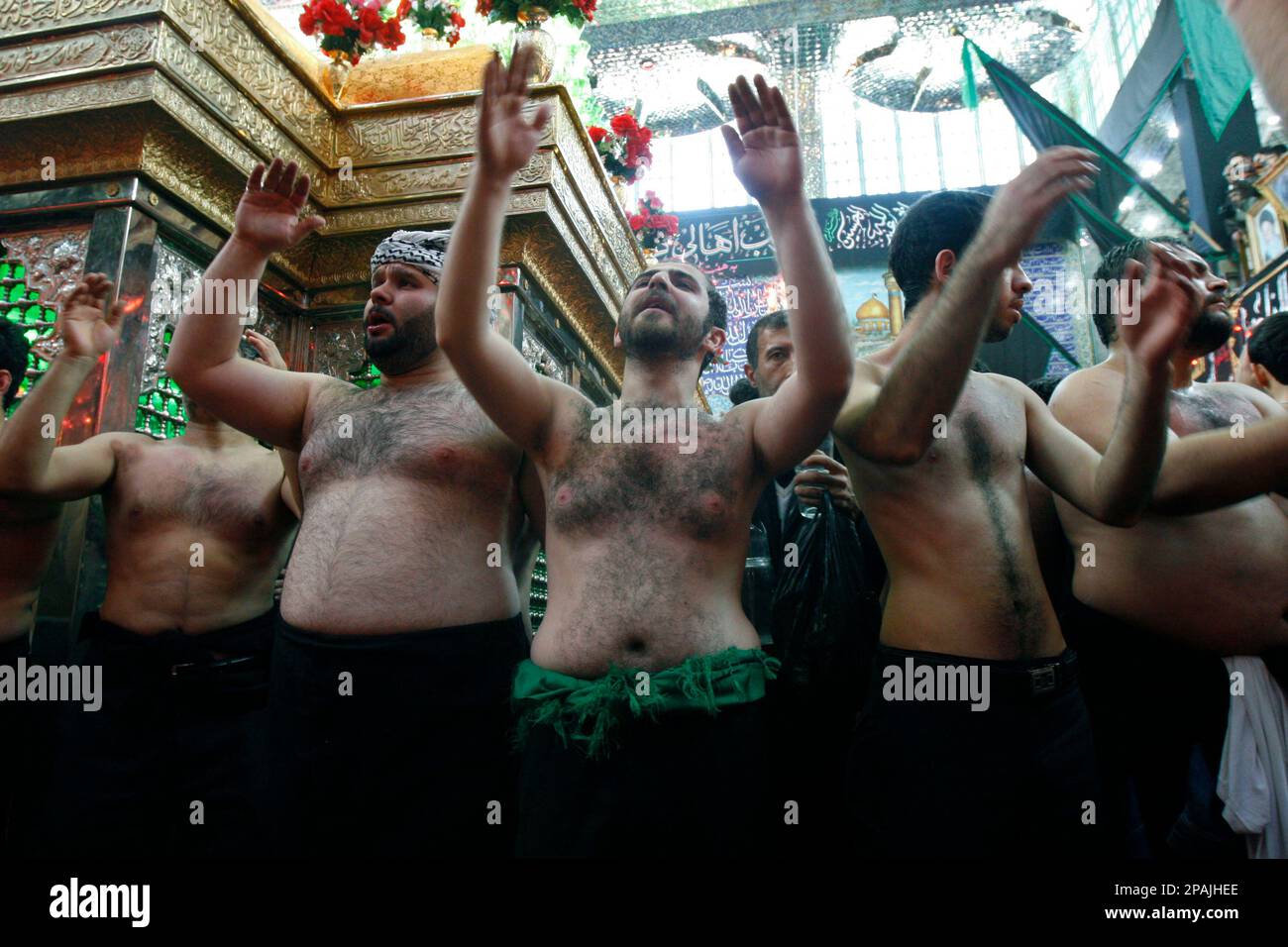 Iranian and Iraqi Shiite Muslims beat their chests during religious ...