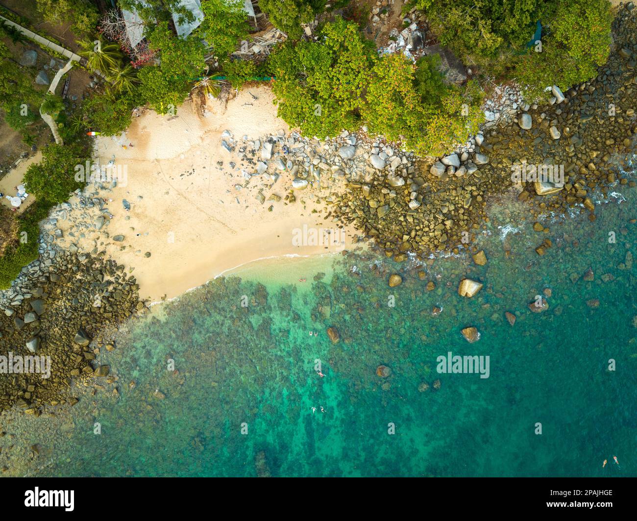 aerial top view Ao Sean small white sand beach lined with rocks ...