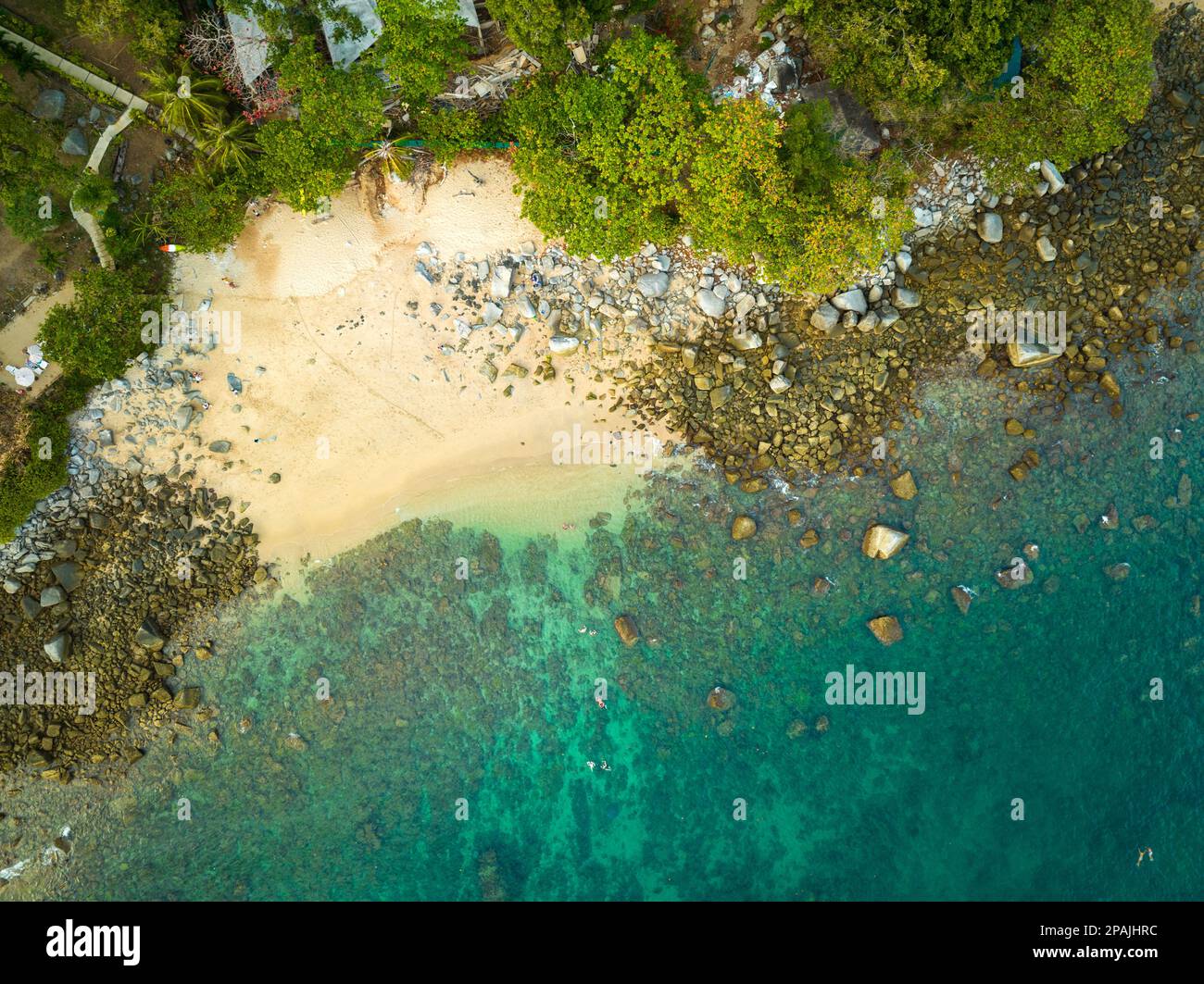 aerial top view Ao Sean small white sand beach lined with rocks ...