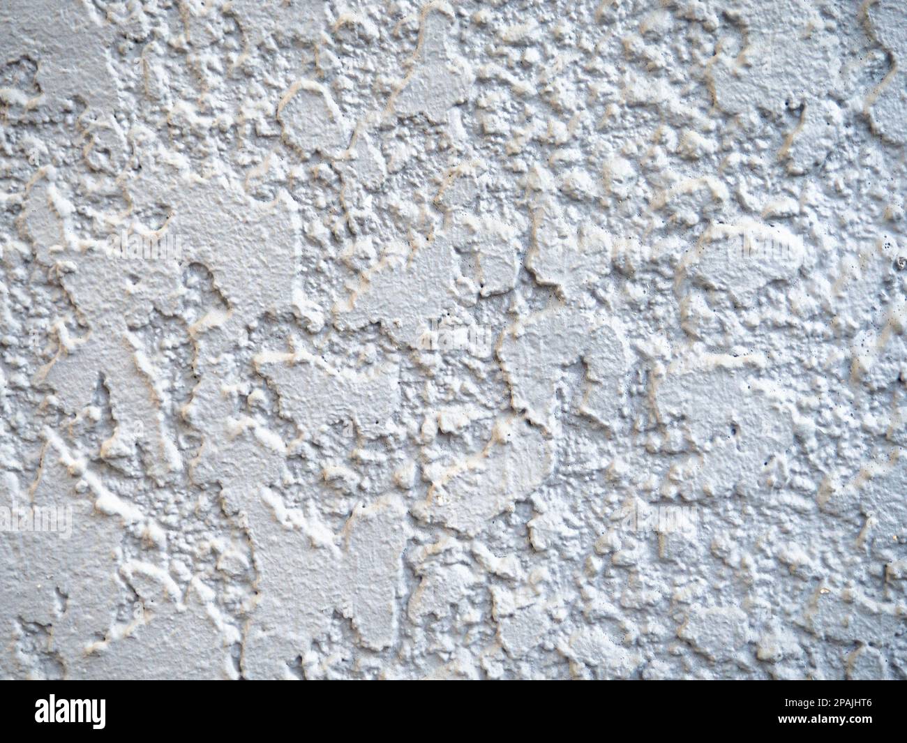 Rough light surface. Background from a stone wall. Cement stains. House ...