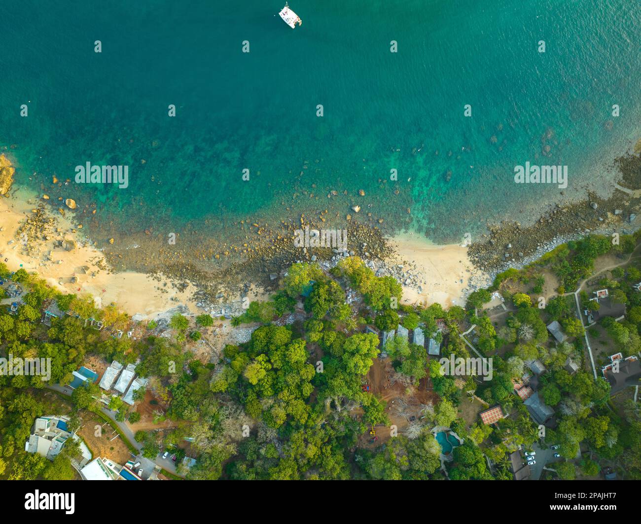 aerial top view Ao Sean small white sand beach lined with rocks ...