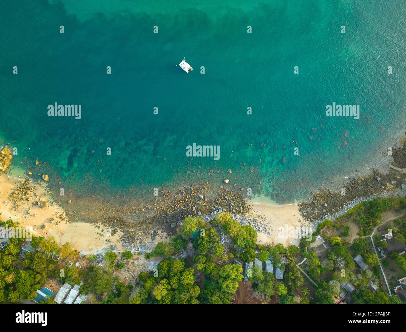 aerial top view Ao Sean small white sand beach lined with rocks ...