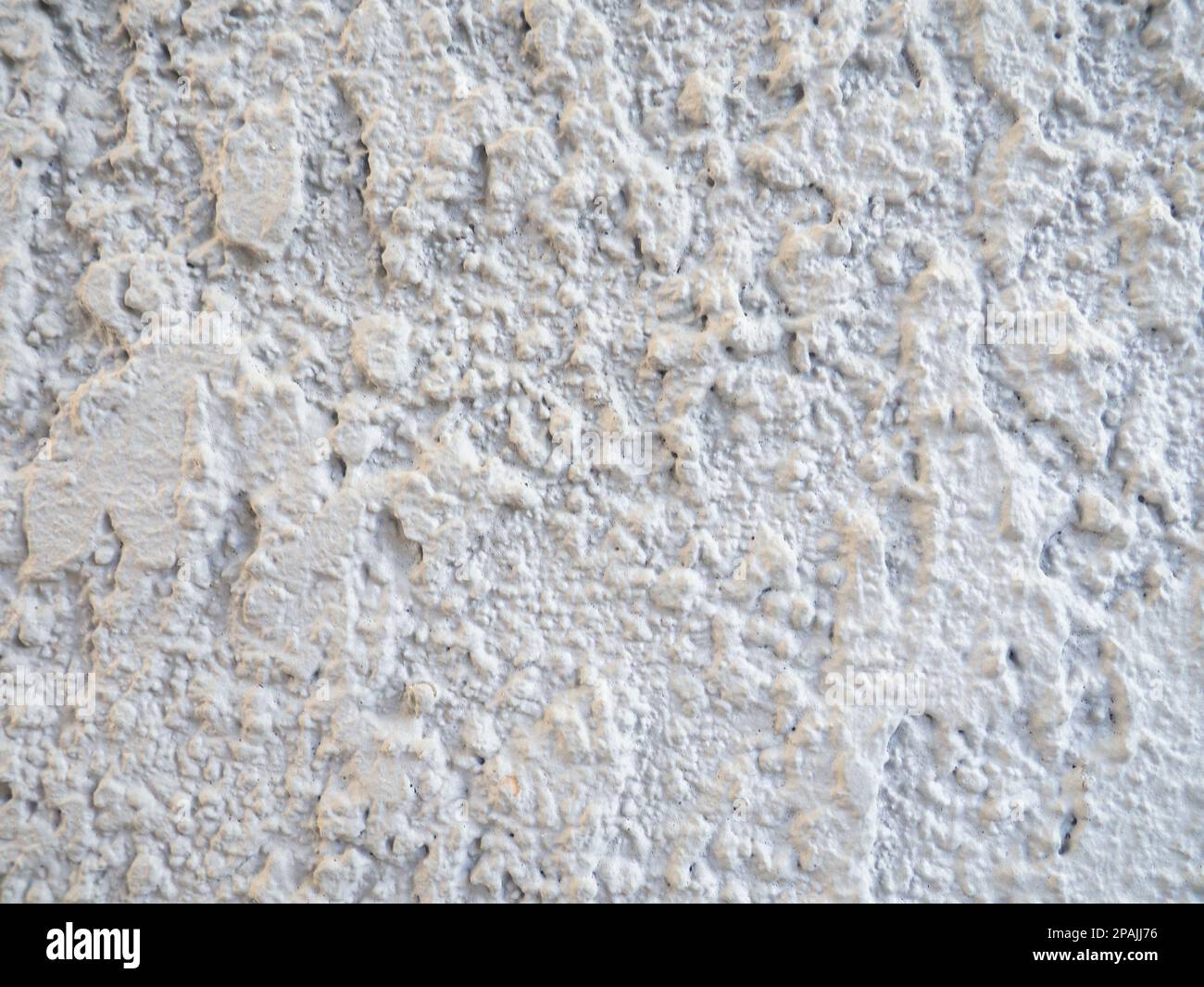 Rough light surface. Background from a stone wall. Cement stains. House ...