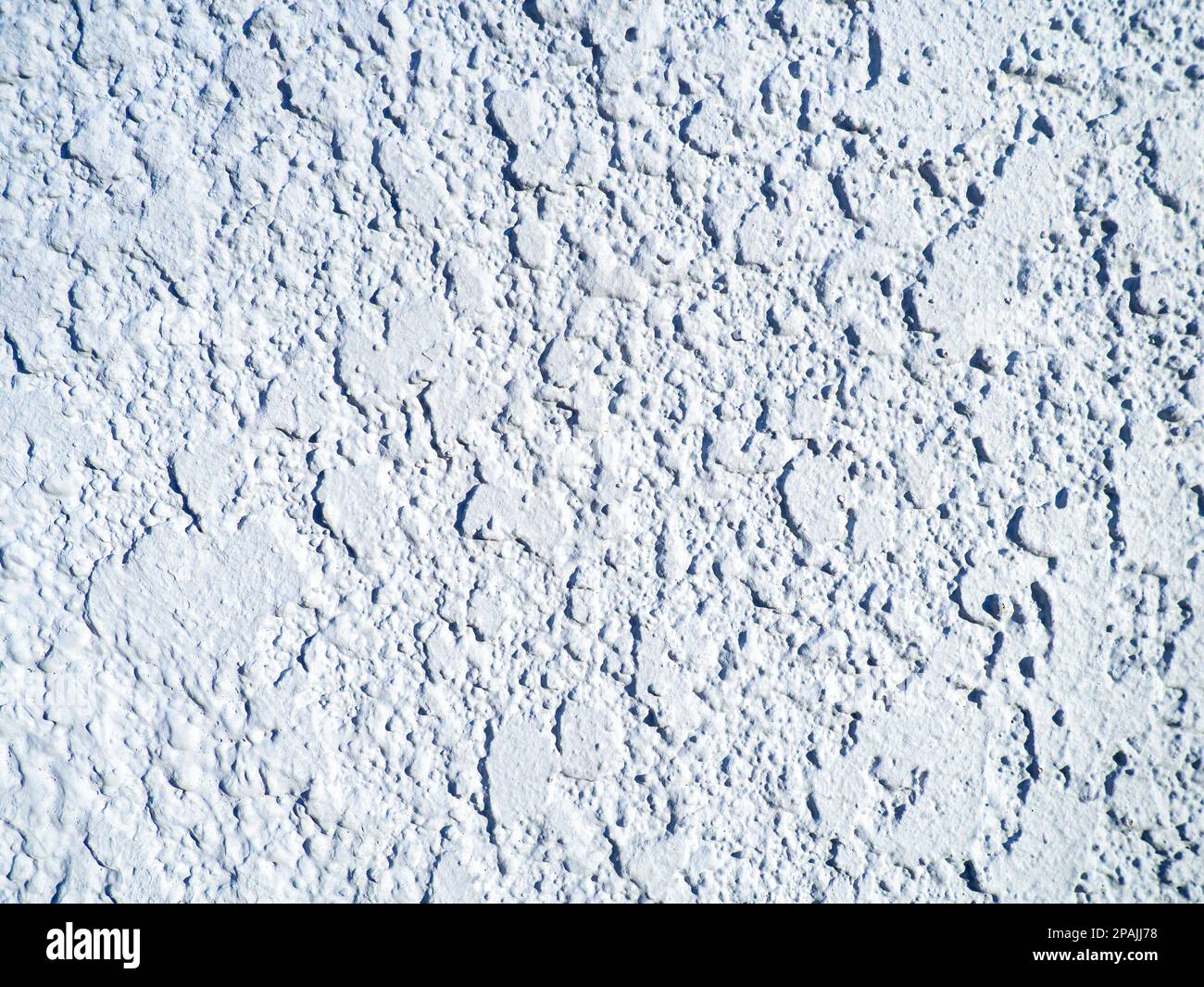 Rough light surface. Background from a stone wall. Cement stains. House ...