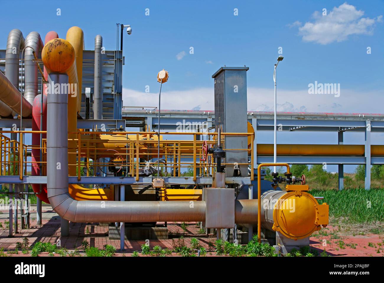 Oil pipes and valves Stock Photo - Alamy