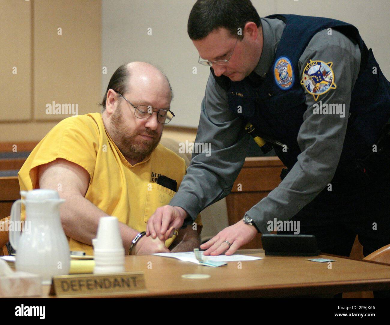 John Carlin III is fingerprinted in an Anchorage, Alaska courtroom ...