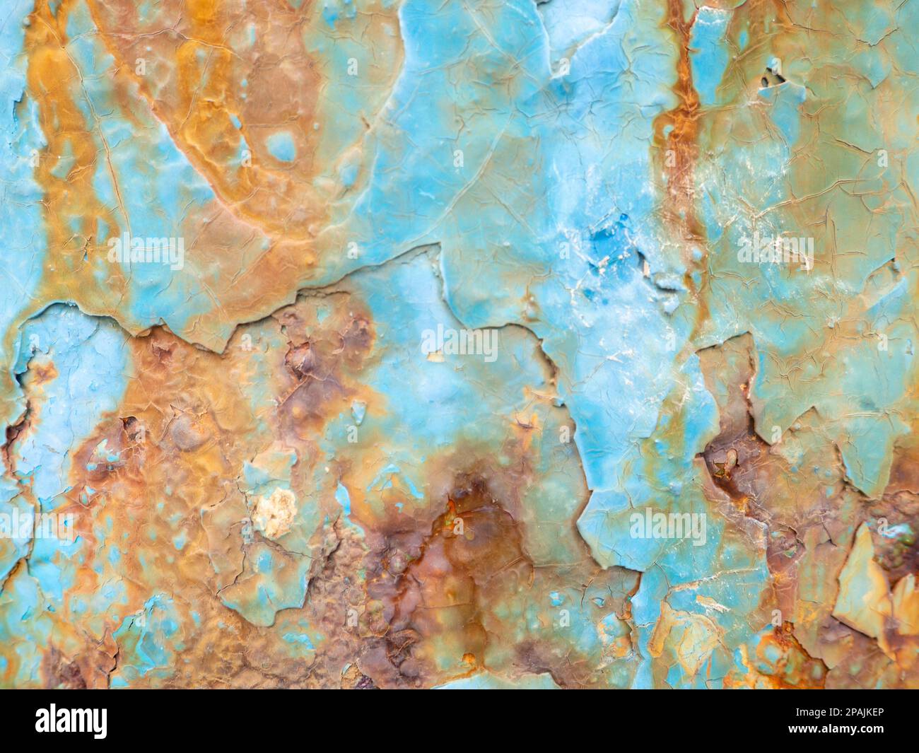 Rust on a blue surface. Cracks in the paint. Old iron. Rusty stains on ...
