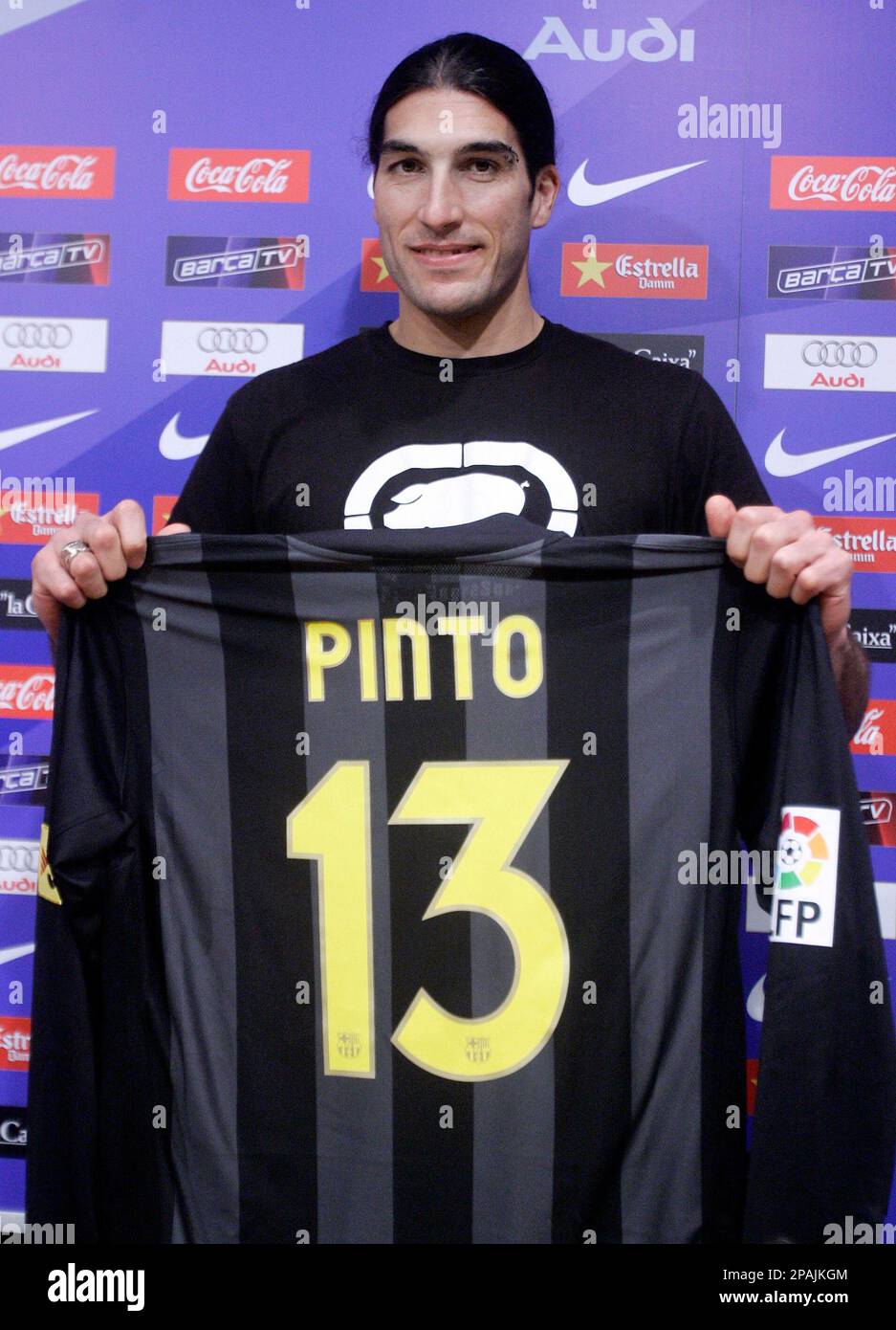 Goalkeeper Jose Manuel Pinto poses with his new jersey during his ...