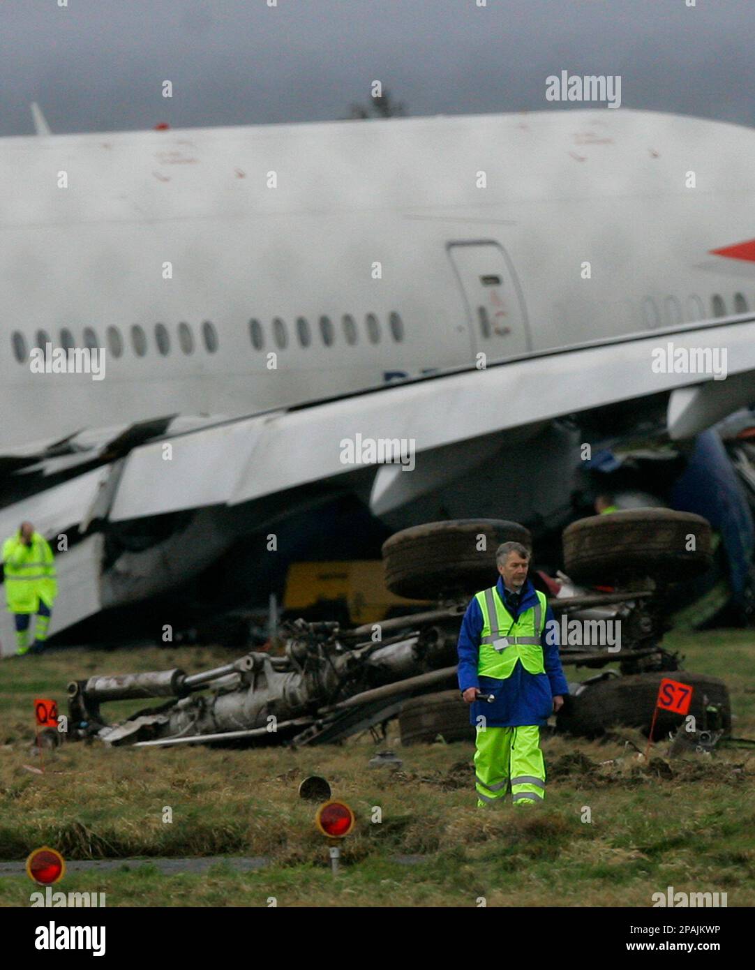 Accident investigators look through the wreckage Friday Jan. 18, 2008 ...