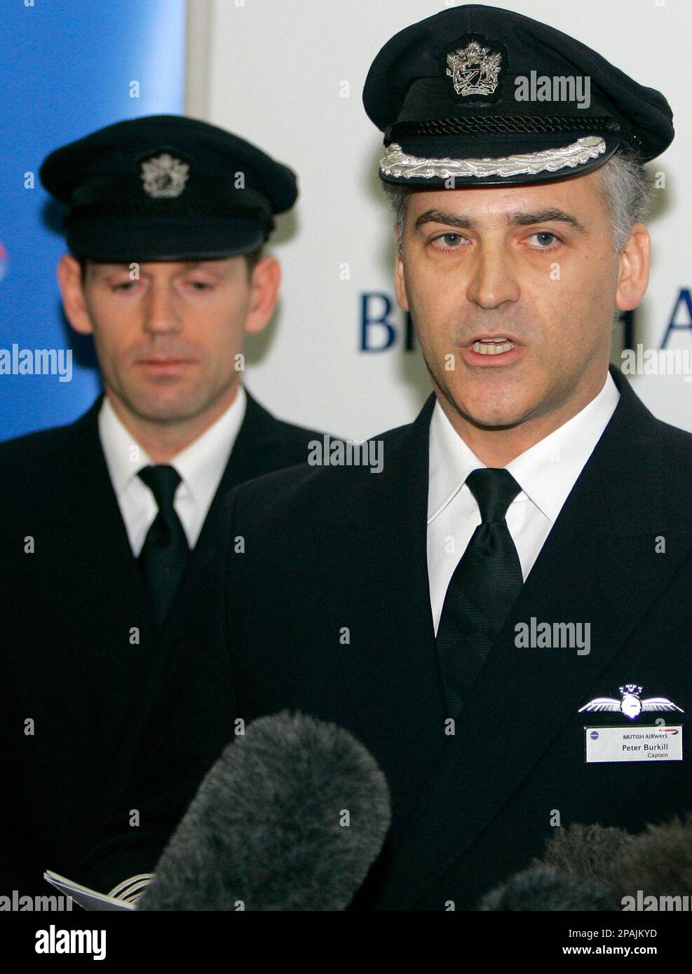 Captain Peter Burkill, right, watched by First Senior Officer John ...
