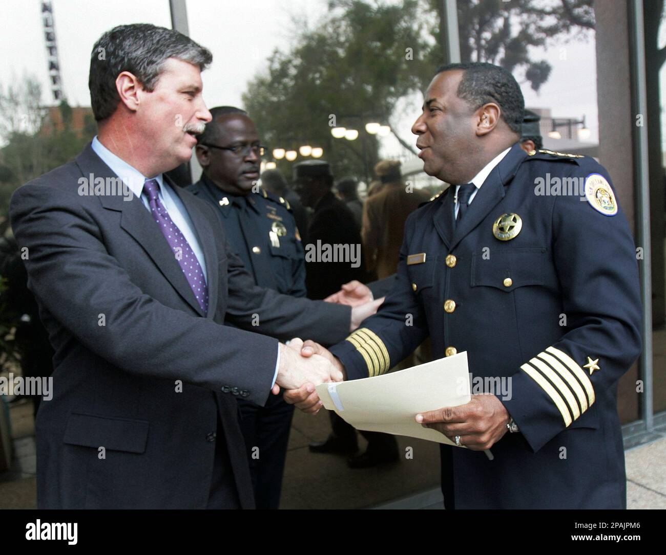 U.S. Attorney Jim Letten, left, greets New Orleans Police Chief Warren ...