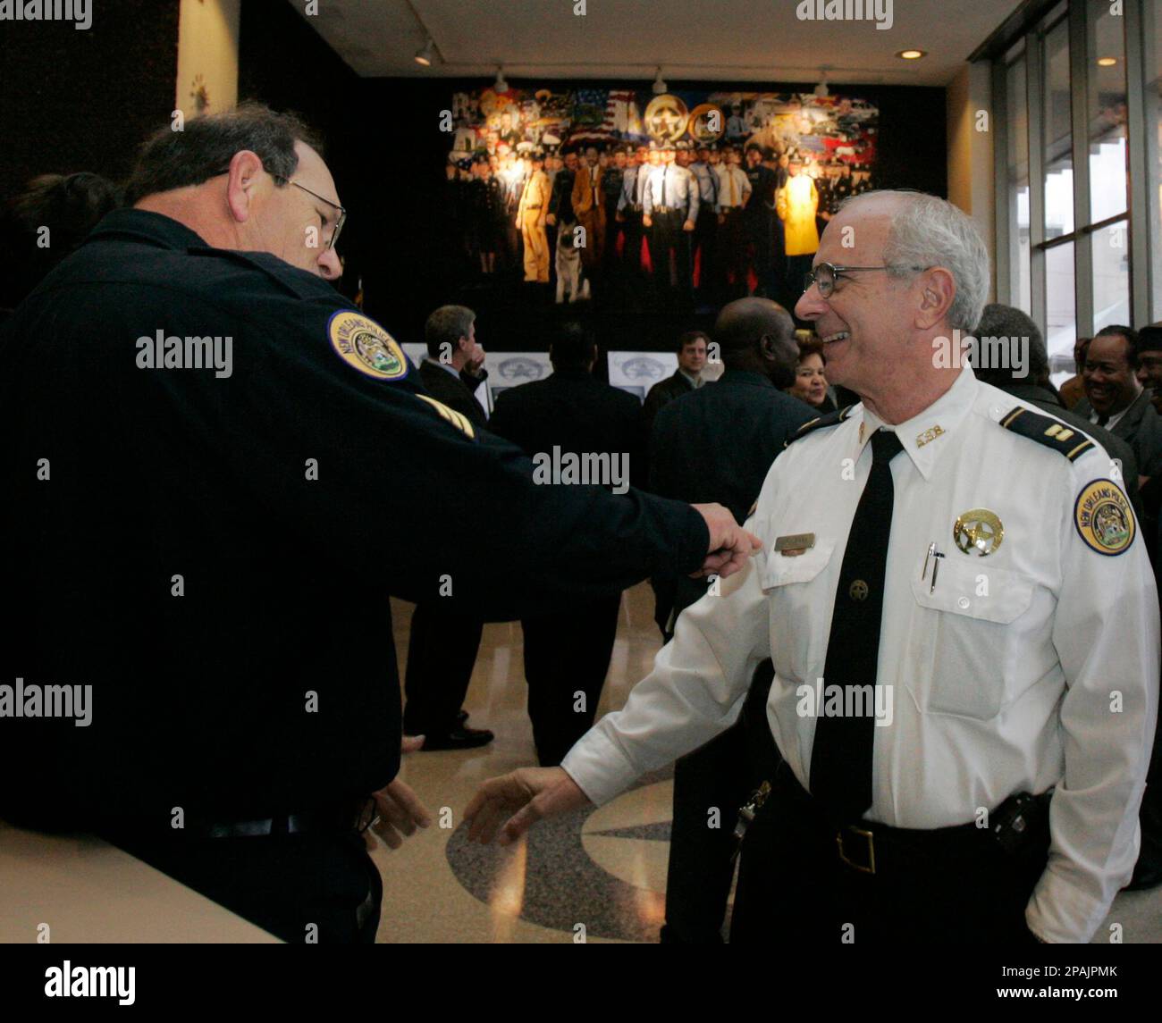 New Orleans police Capt. Ernest Demma, right, greets Sgt. John Faust in ...