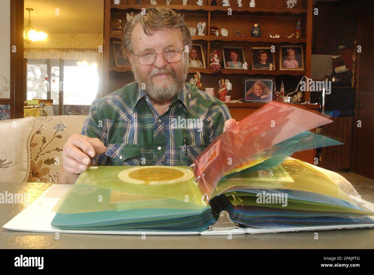 **ADVANCE FOR WEEKEND EDITIONS, JAN.19-20**John Schrag leafs through a ...